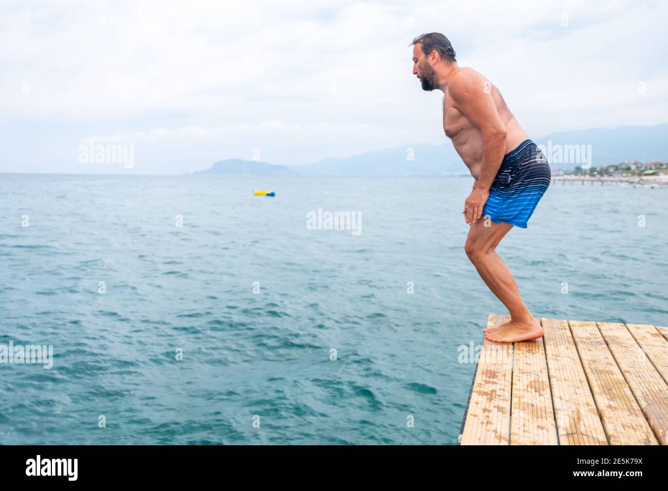 Man jumping inside the ocean Stock Photo - Alamy
