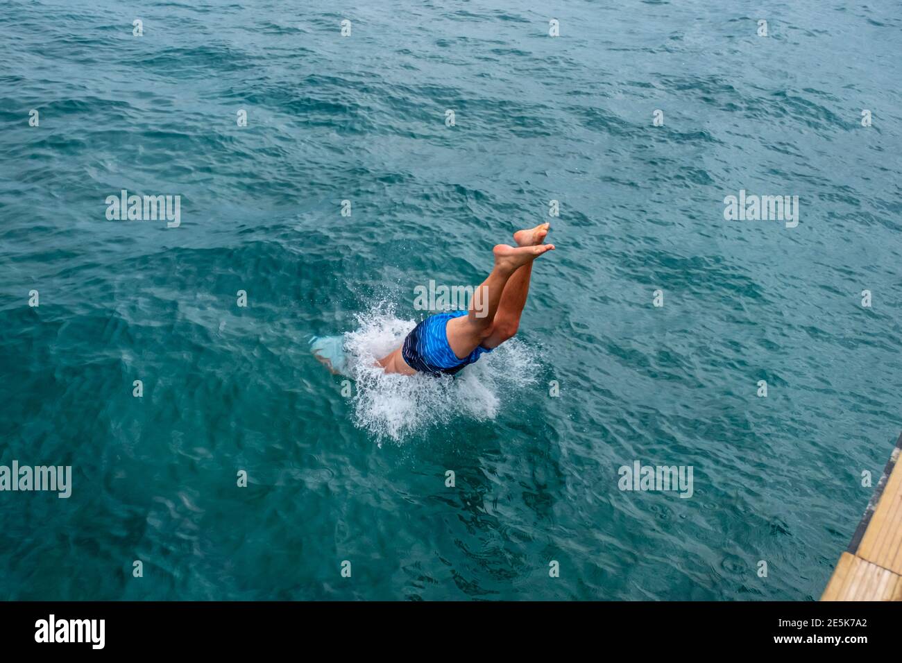 Man jumping inside the ocean Stock Photo - Alamy