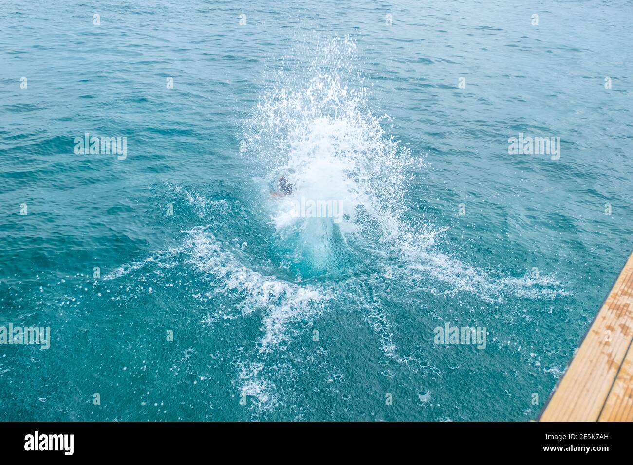 Man jumping inside the ocean Stock Photo - Alamy