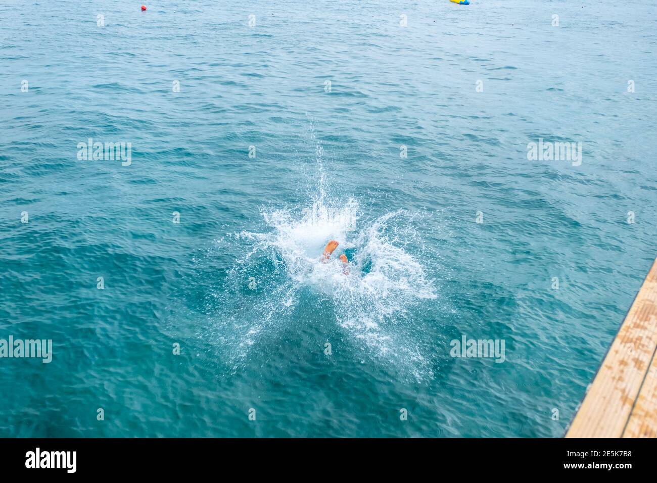 Man jumping inside the ocean Stock Photo - Alamy