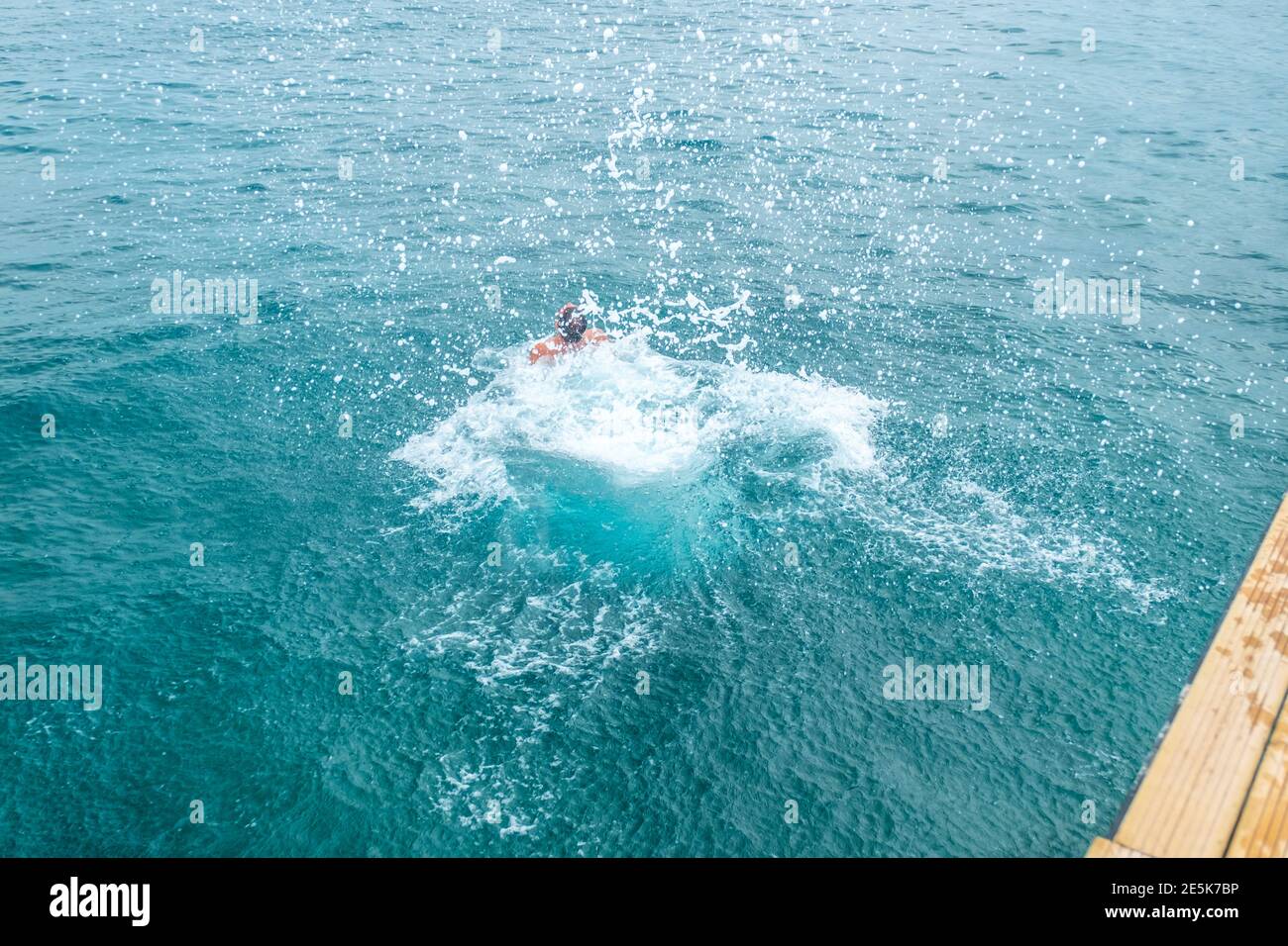 Man jumping inside the ocean Stock Photo - Alamy