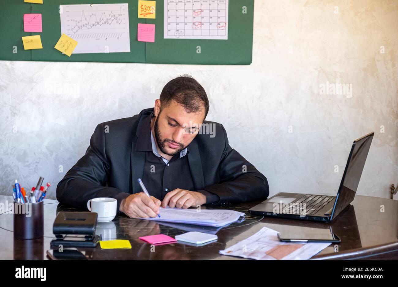 a portrait of man working in his office from home Stock Photo - Alamy