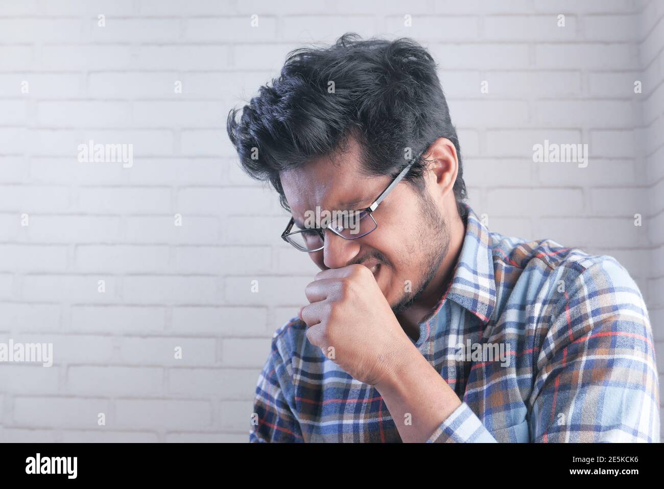 young asian man coughing and sneezes close up Stock Photo - Alamy