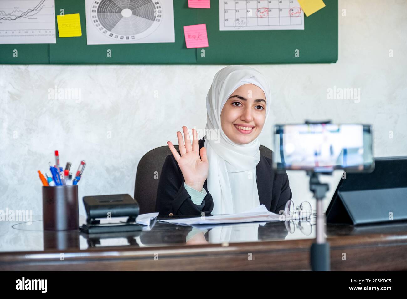 Happy muslim woman coach teacher webinar speaker looking at camera ...
