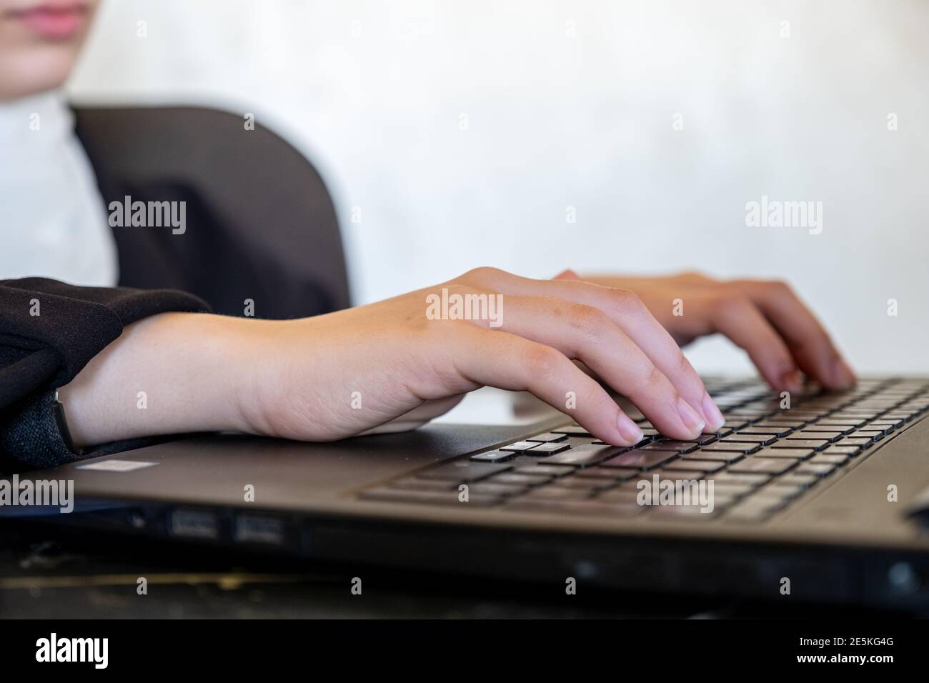 woman hands on laptop keyboard while typing Stock Photo - Alamy