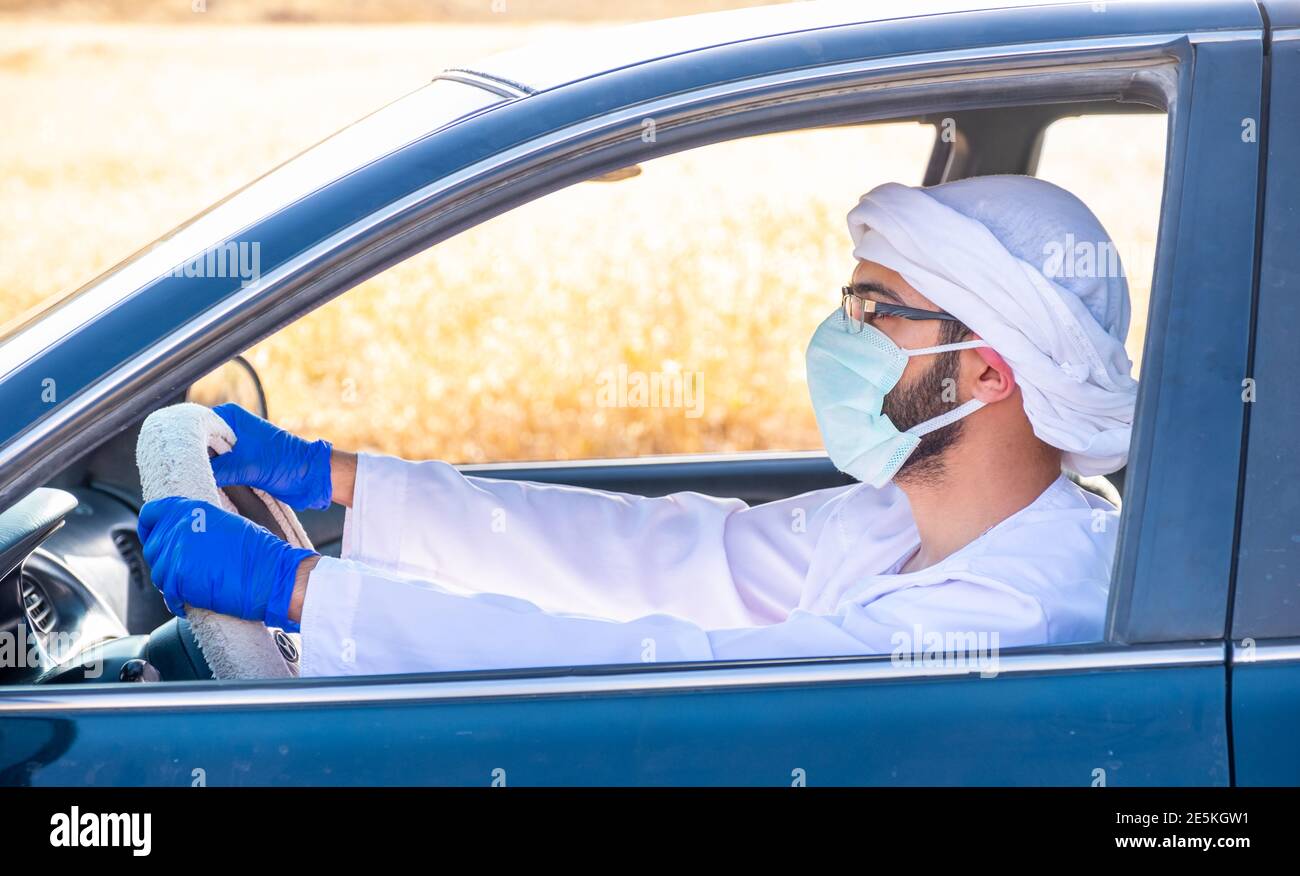 Arab man driving a car in the pandamic Stock Photo - Alamy