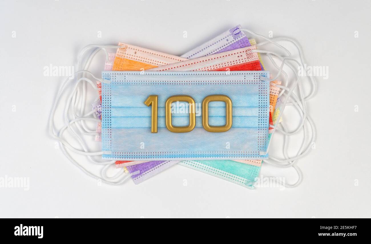 number 100 on medical disposable masks. Color Surgical Mask. compliance ...