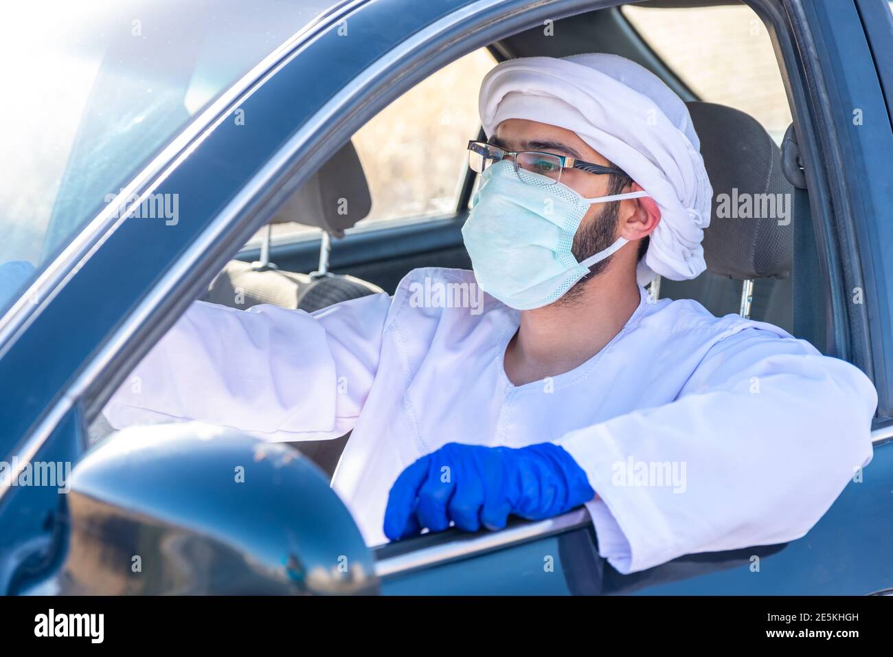 Arab man driving a car in the pandamic Stock Photo - Alamy