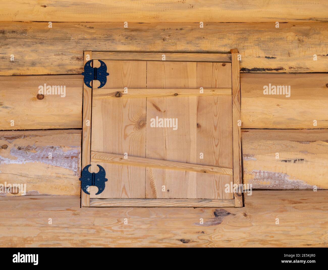 square hatch in the wooden wall. the door is made of wood Stock Photo ...