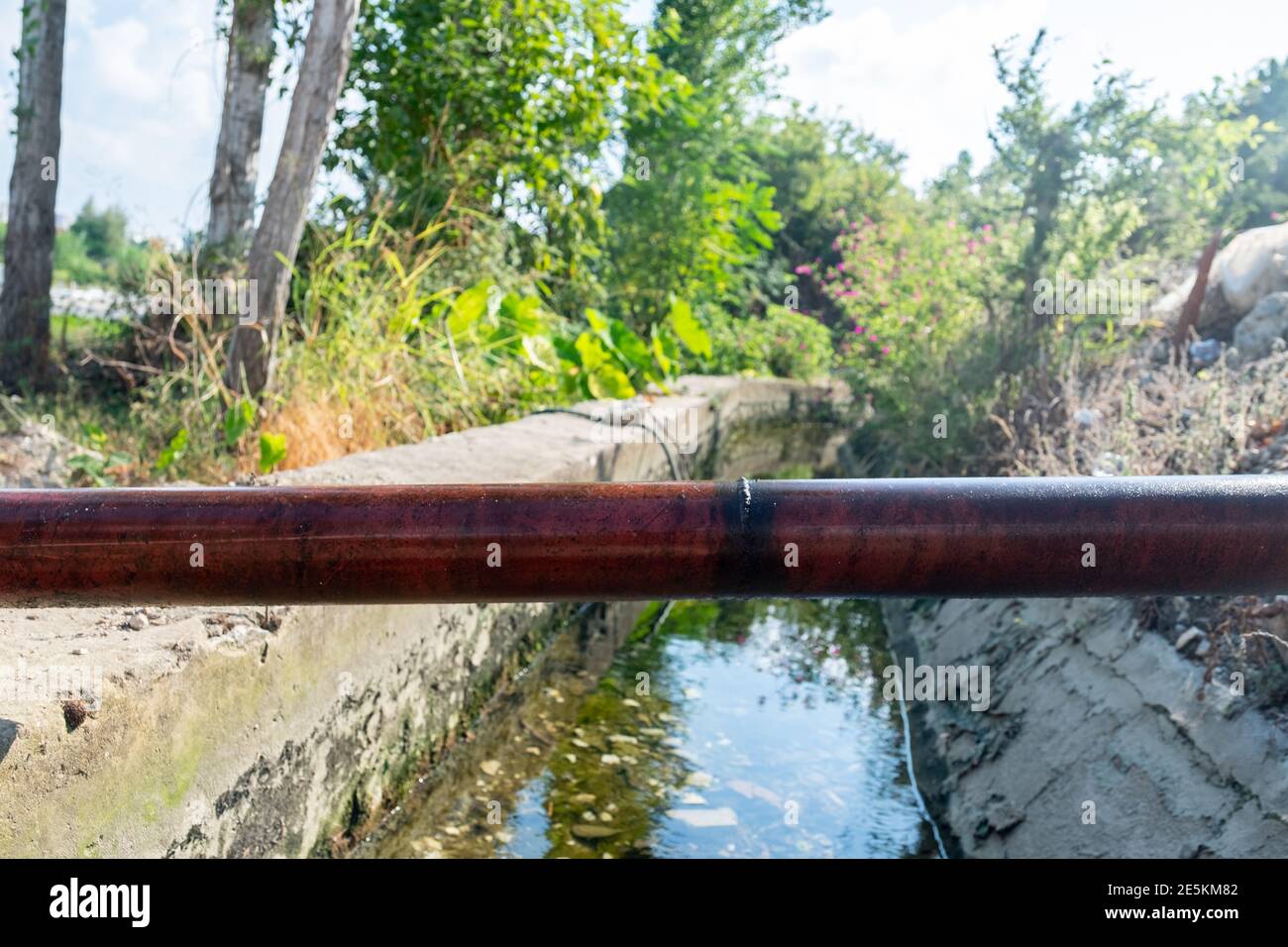Old rusty metallic pipe line for water transmission Stock Photo - Alamy
