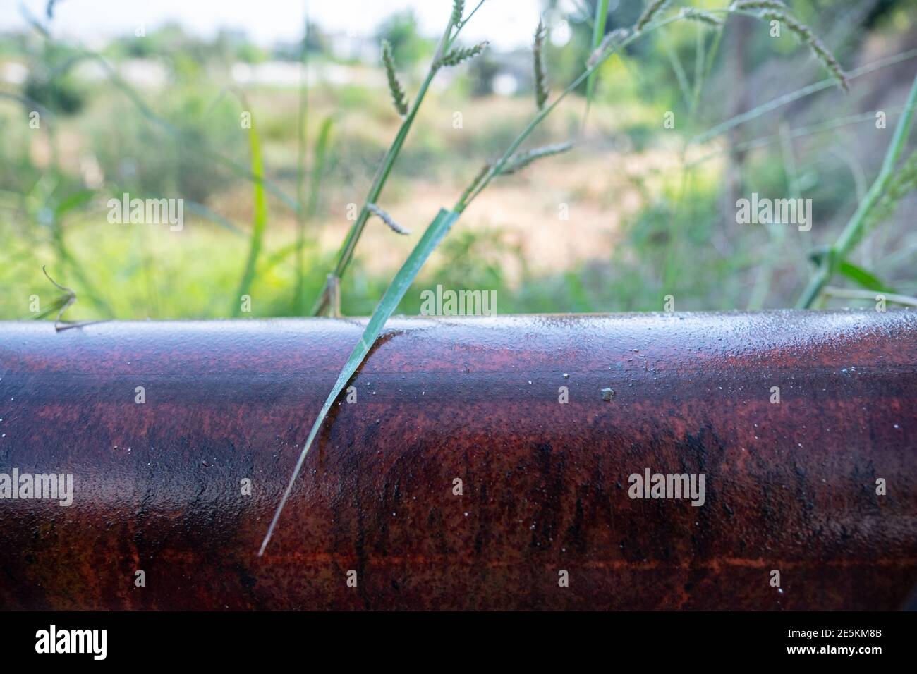 Old rusty metallic pipe line for water transmission Stock Photo - Alamy