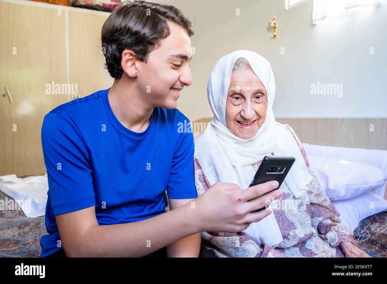 Using technology with different generations Stock Photo - Alamy