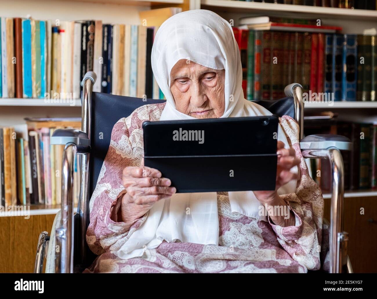 Old woman is using technology Stock Photo - Alamy
