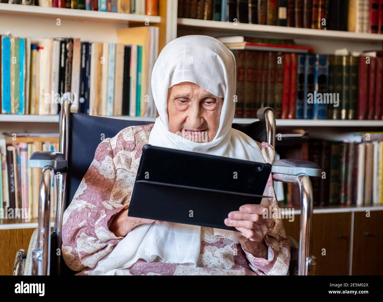 Old woman is using technology Stock Photo - Alamy