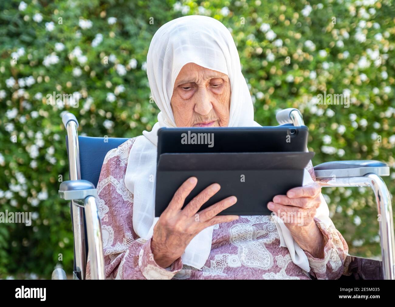 Old woman is using technology Stock Photo - Alamy