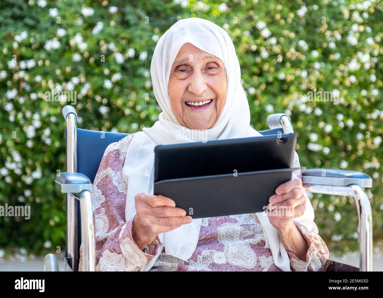 Old woman is using technology Stock Photo - Alamy