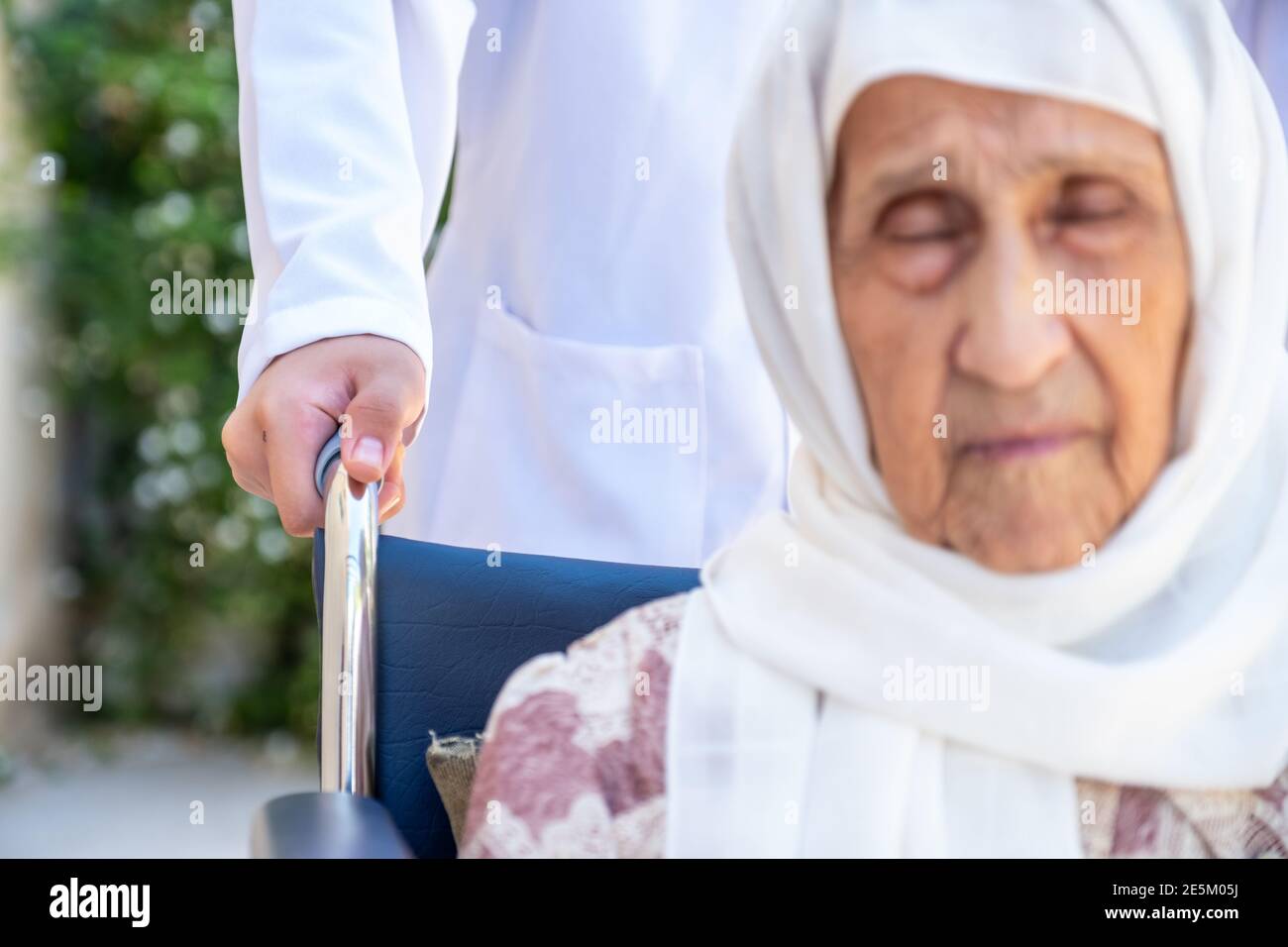 Taking care of an old lady Stock Photo - Alamy