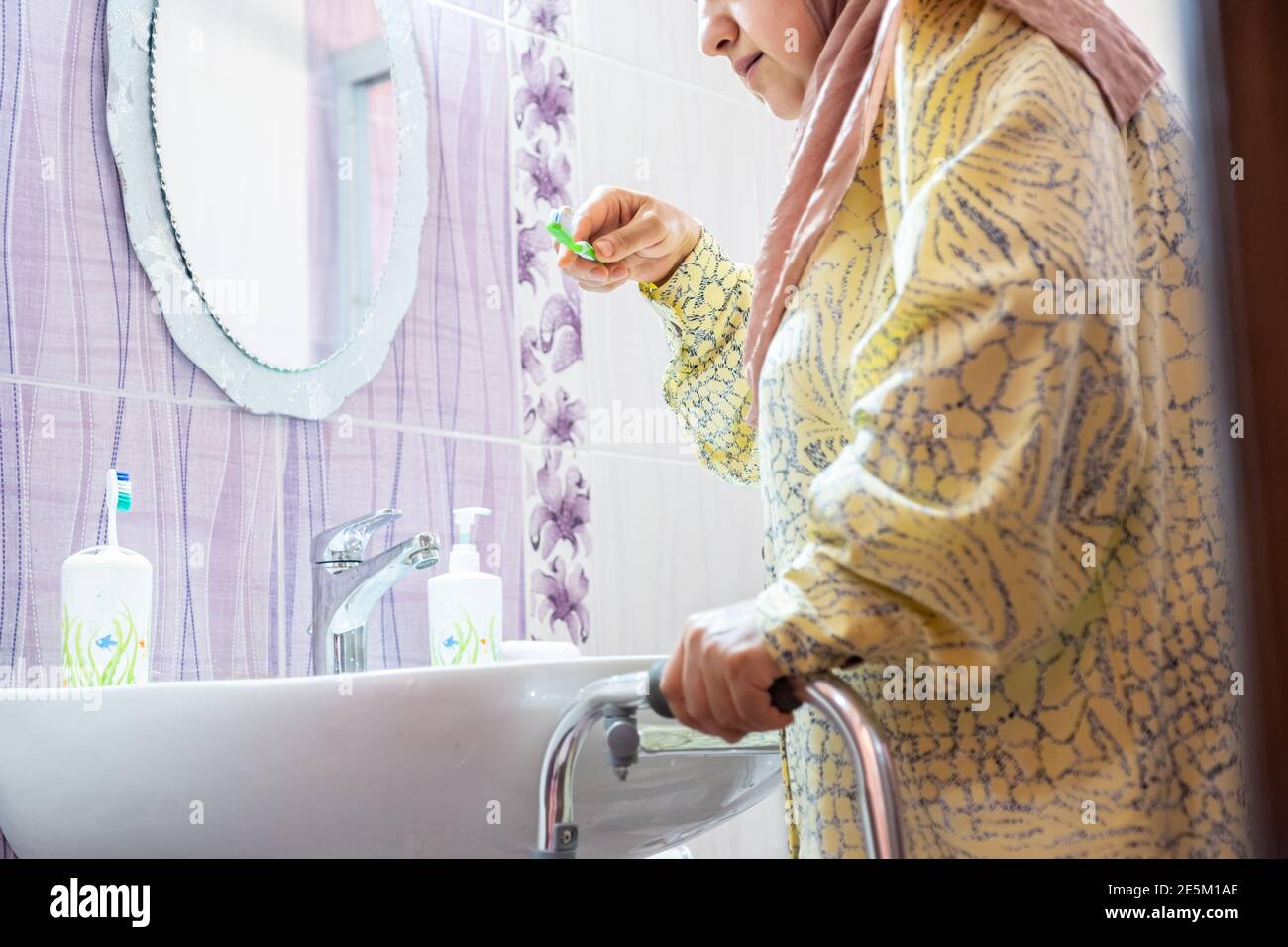 Muslim woman with disability is trying to depend on herself Stock Photo ...