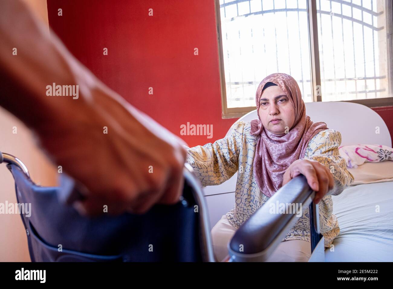 Strong muslim mother with disability Stock Photo - Alamy