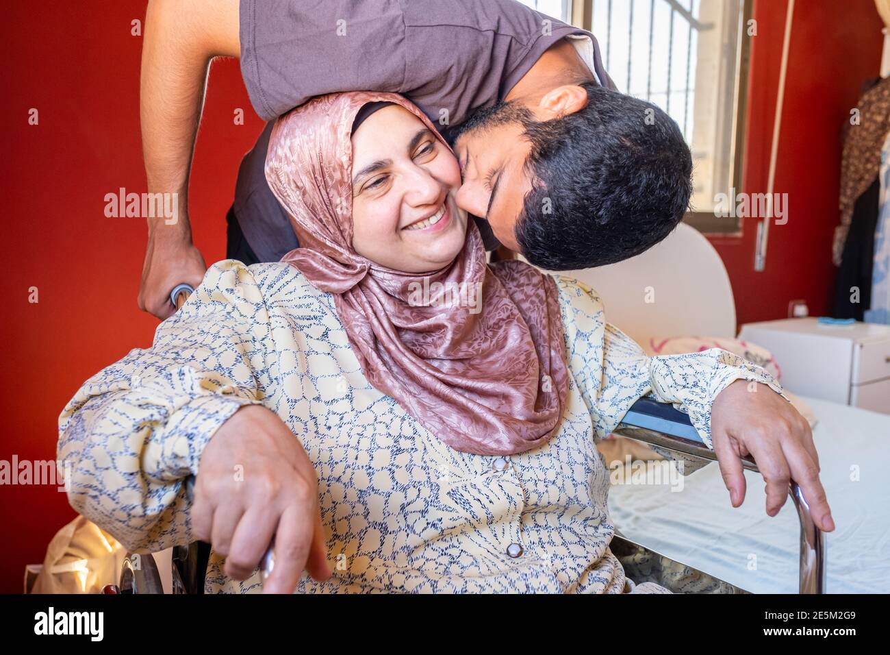 Muslim woman with disability and her beloved son Stock Photo - Alamy