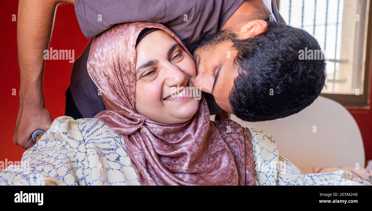 Muslim woman with disability and her beloved son Stock Photo - Alamy