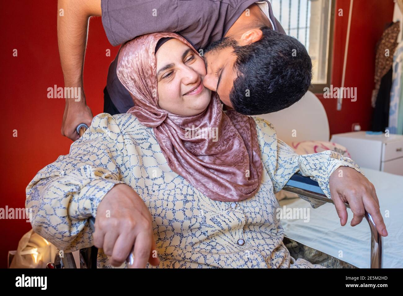 Muslim woman with disability and her beloved son Stock Photo - Alamy