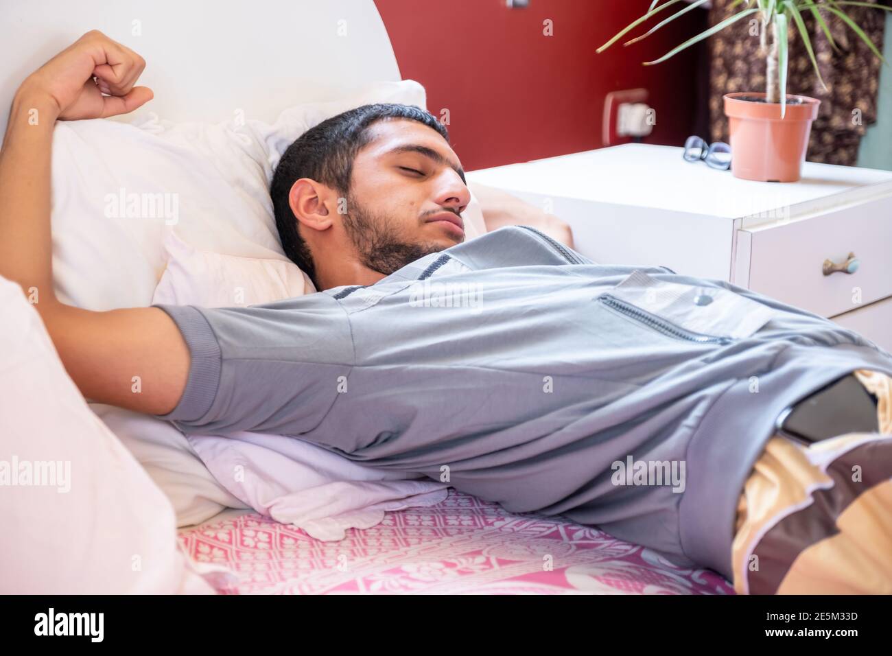 Muslim man having a nap in the bed room Stock Photo - Alamy