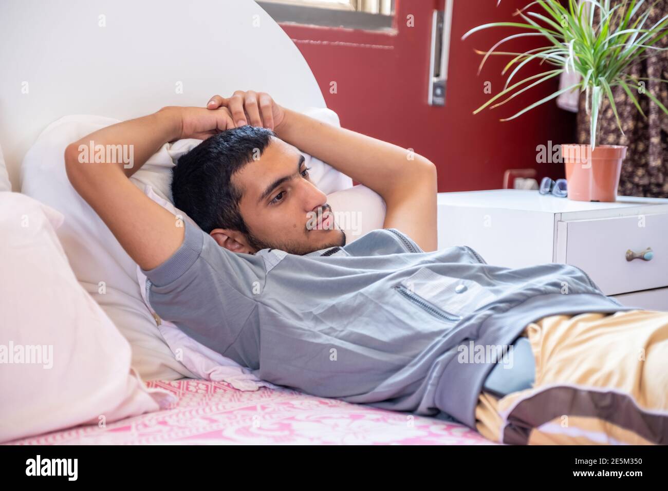 Muslim man having a nap in the bed room Stock Photo - Alamy
