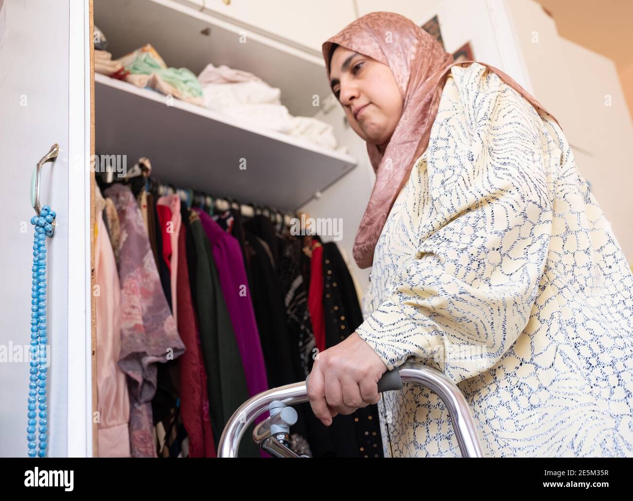 Muslim woman with disability is trying to depend on herself Stock Photo ...