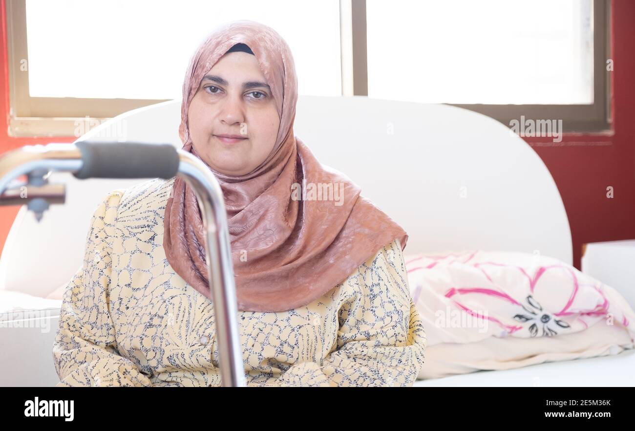 Muslim woman with disability is trying to depend on herself Stock Photo ...