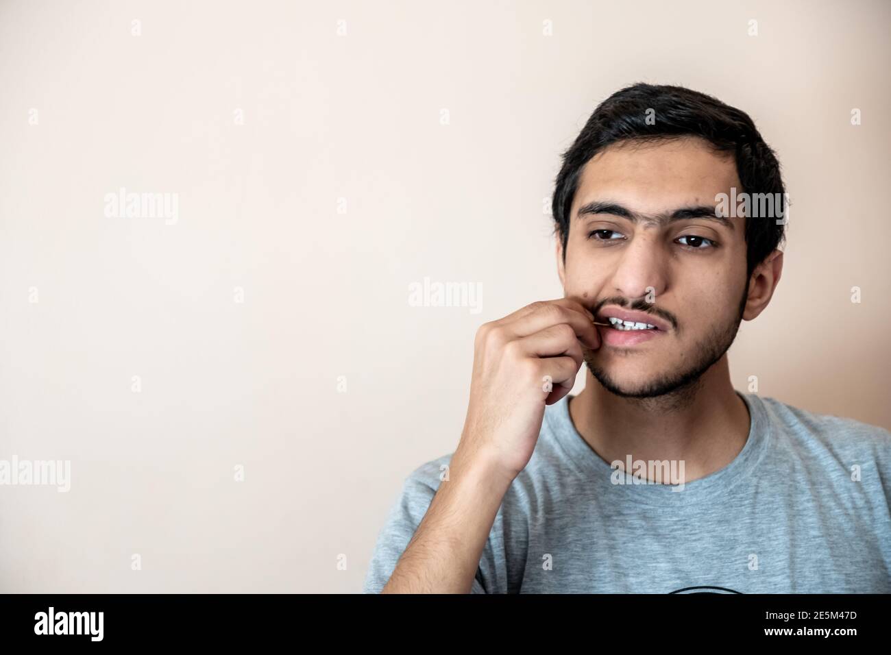 Muslim man is using a dental thread Stock Photo - Alamy