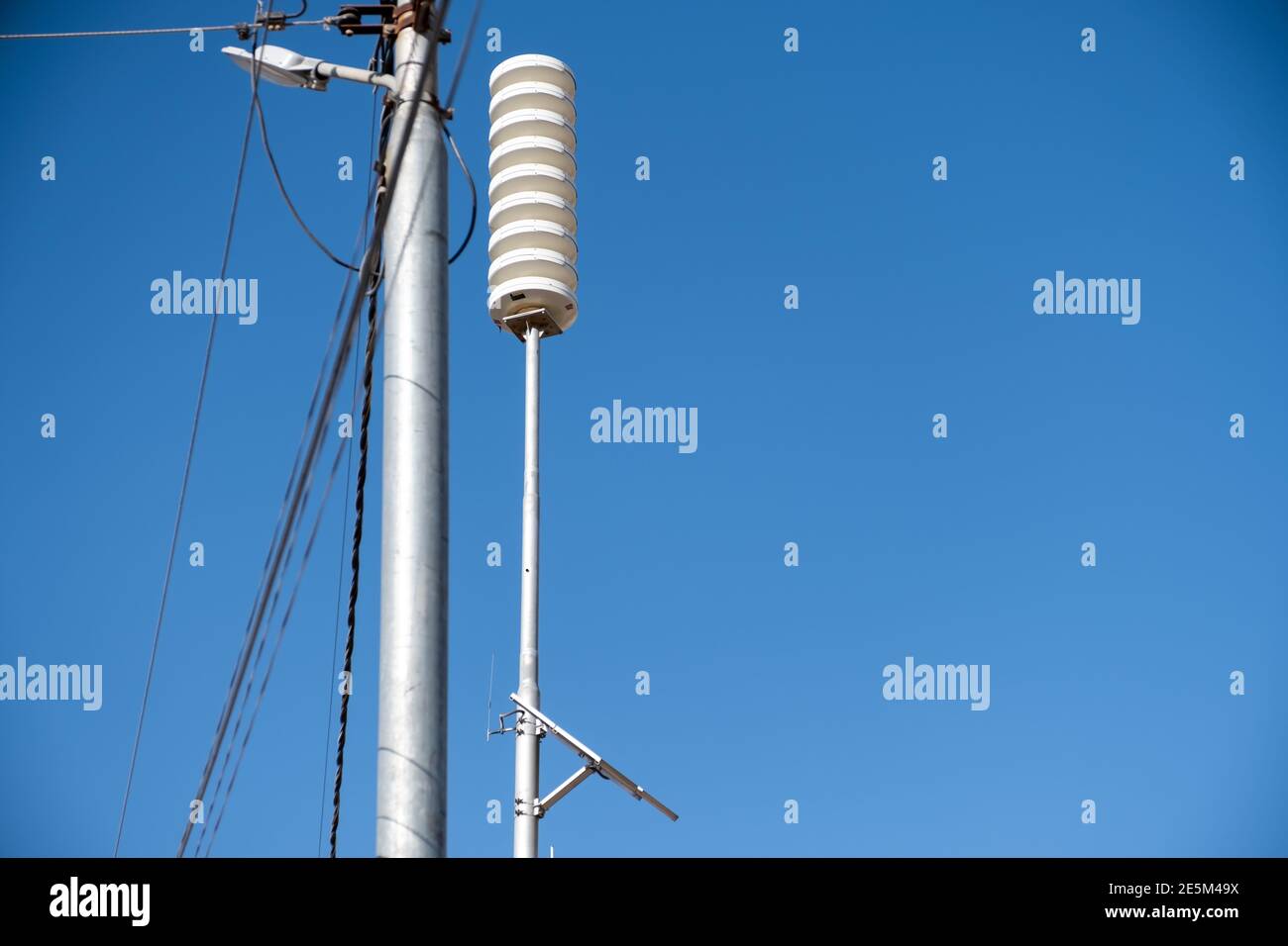 Outdoor warning siren with solar panel Stock Photo - Alamy