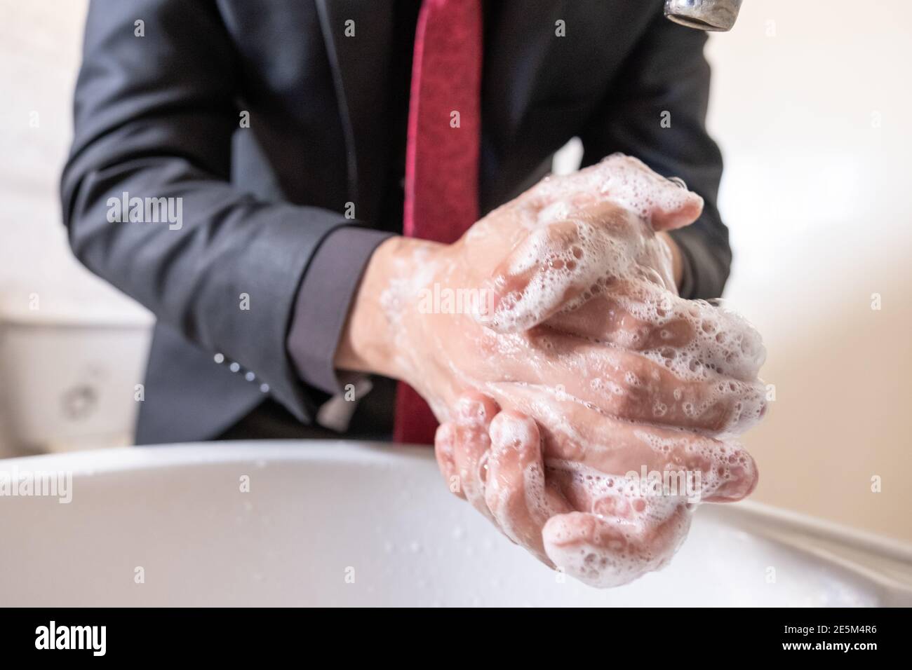 Muslim guy washing his hands Stock Photo - Alamy