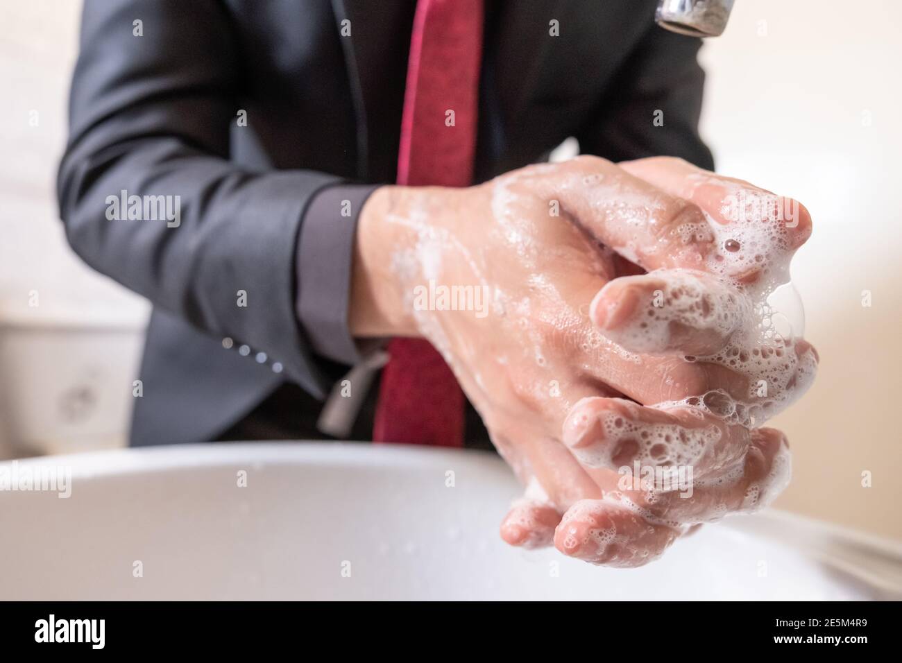 Muslim guy washing his hands Stock Photo - Alamy