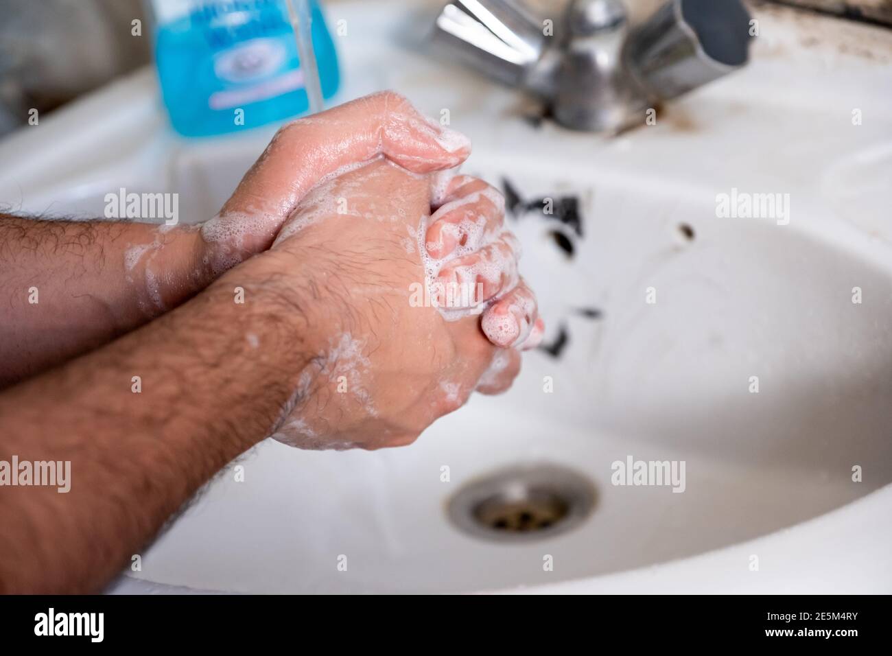 Muslim guy washing his hands Stock Photo - Alamy