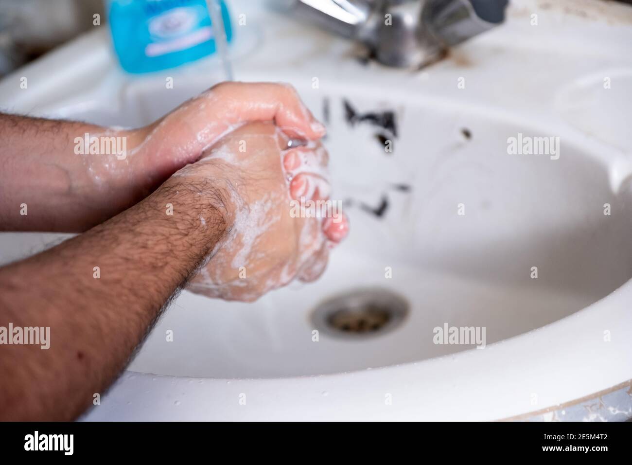 Muslim guy washing his hands Stock Photo - Alamy