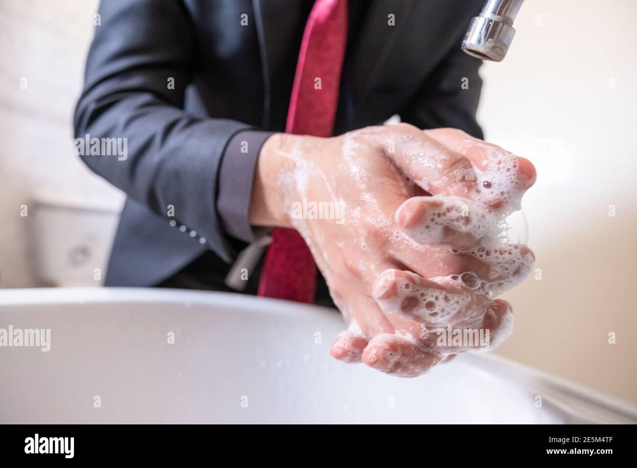 Muslim guy washing his hands Stock Photo - Alamy