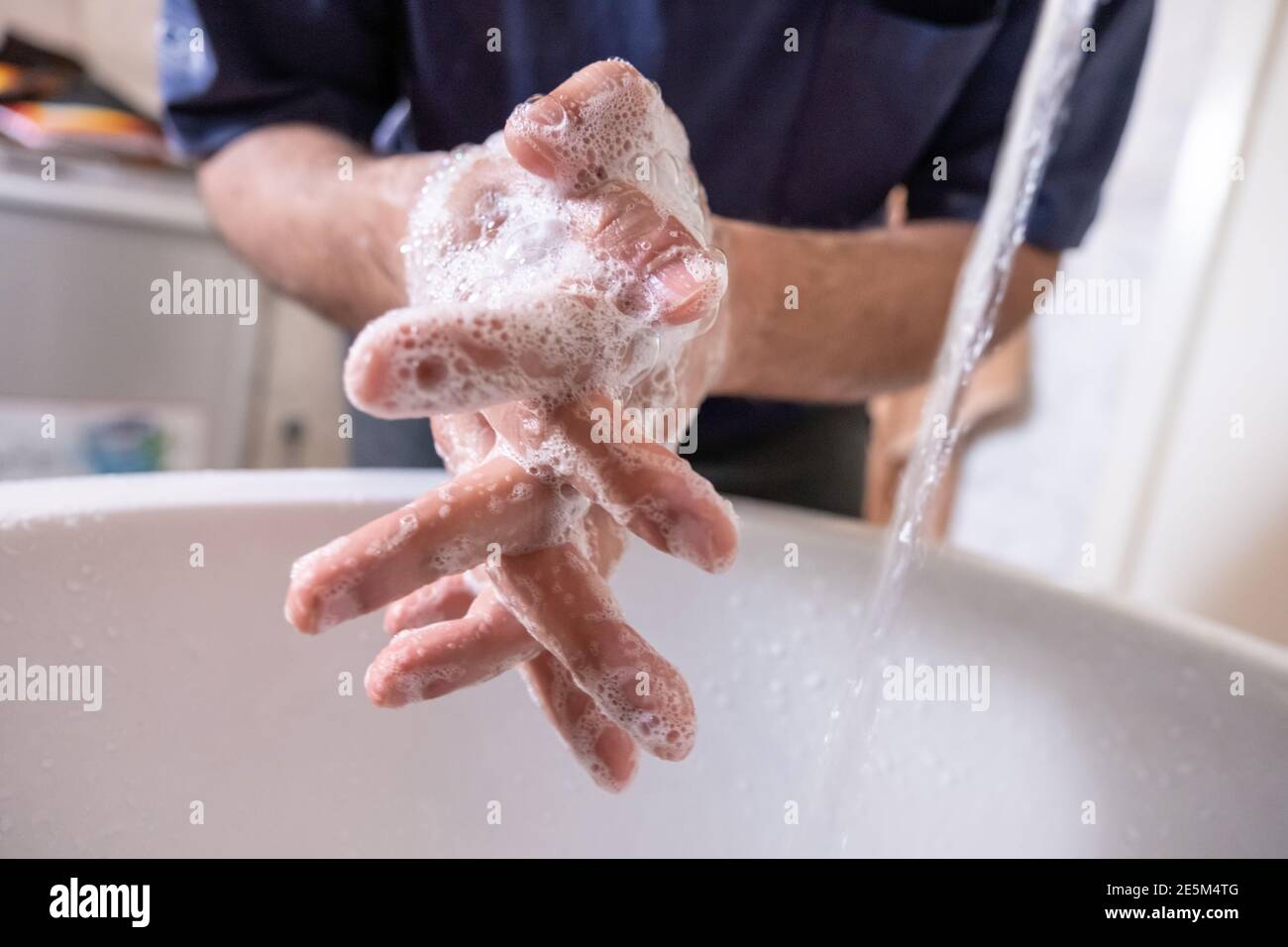 Muslim guy washing his hands Stock Photo - Alamy