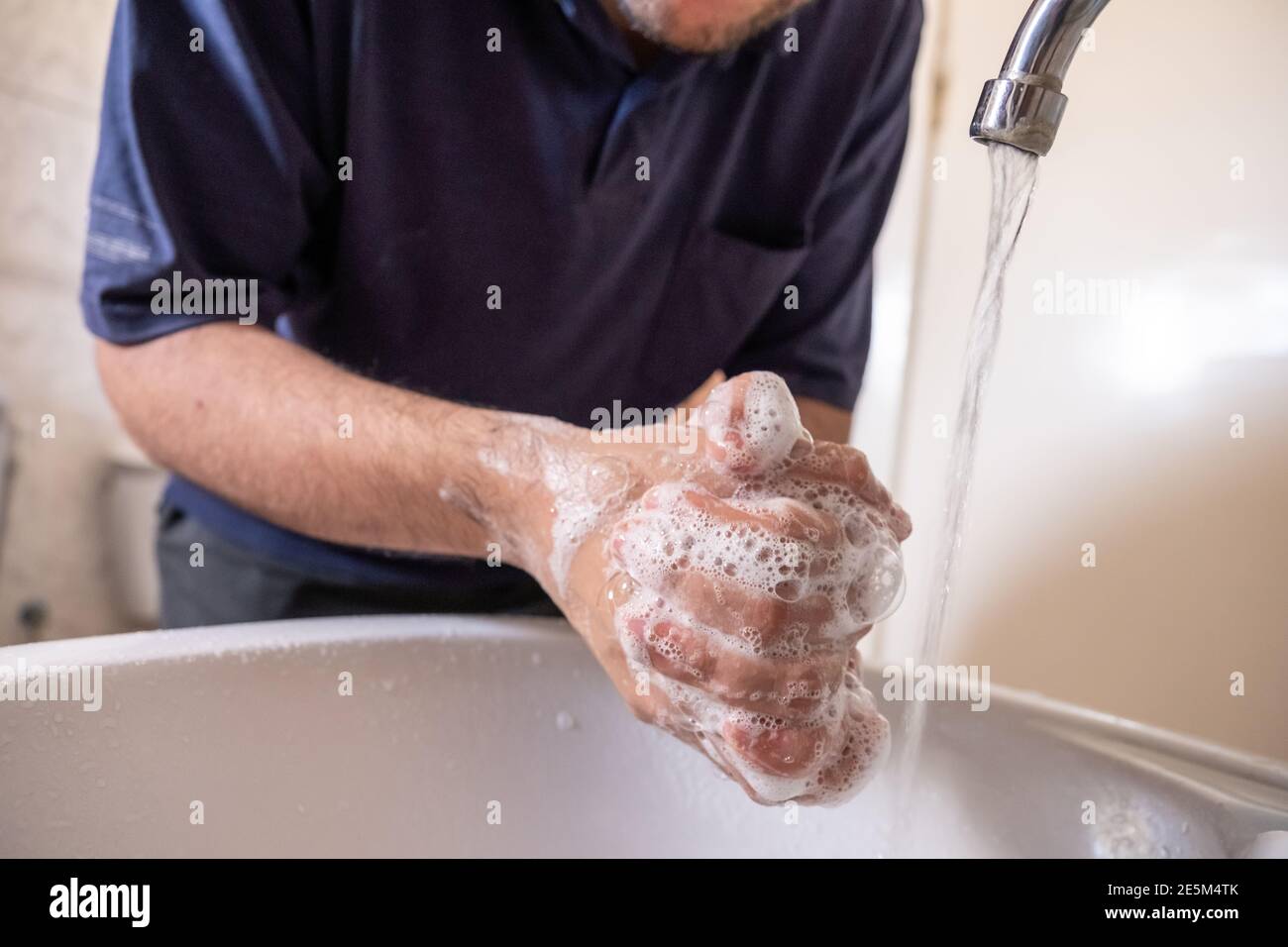 Muslim guy washing his hands Stock Photo - Alamy