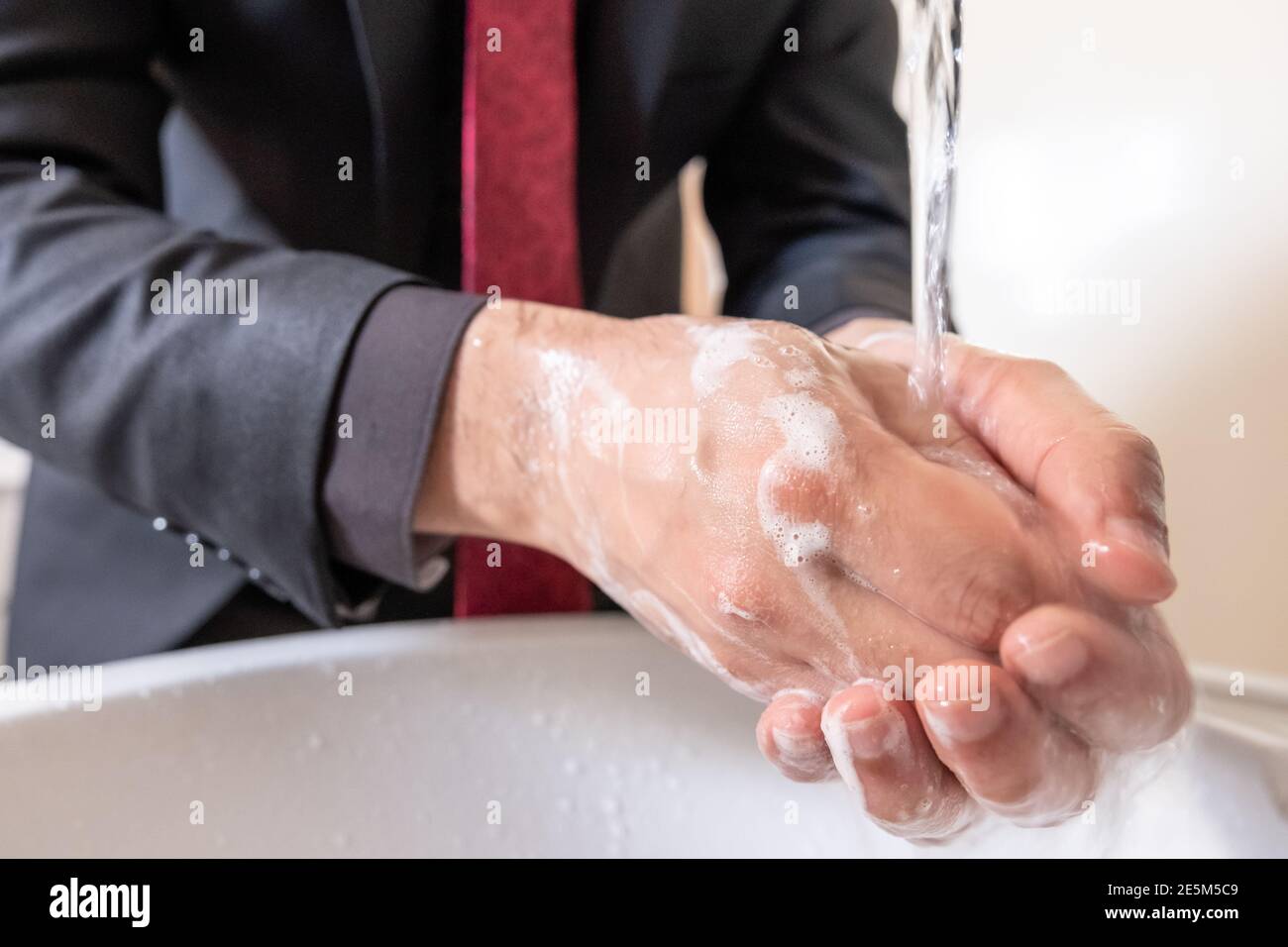 Muslim guy washing his hands Stock Photo - Alamy