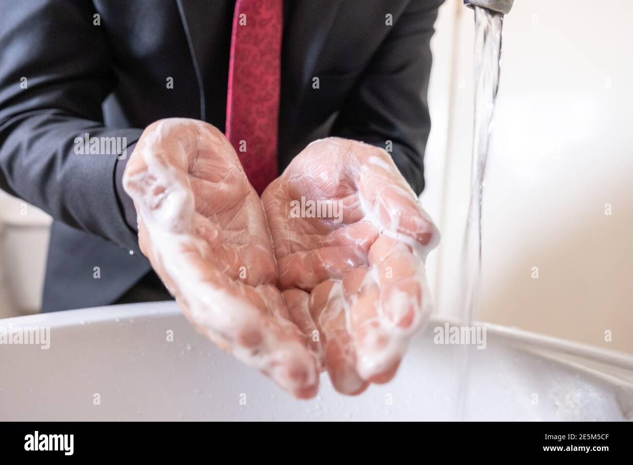 Muslim guy washing his hands Stock Photo - Alamy