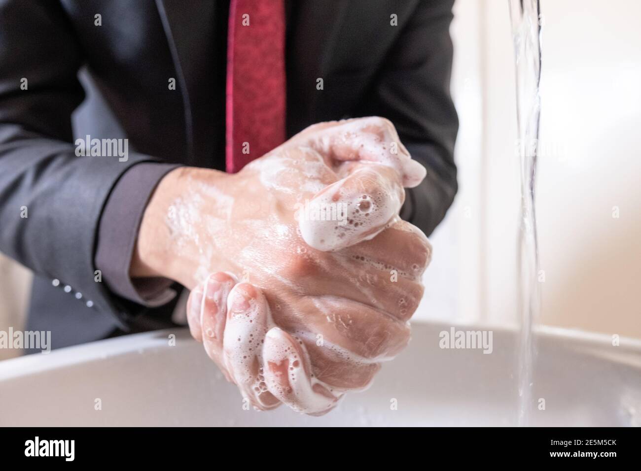 Muslim guy washing his hands Stock Photo - Alamy