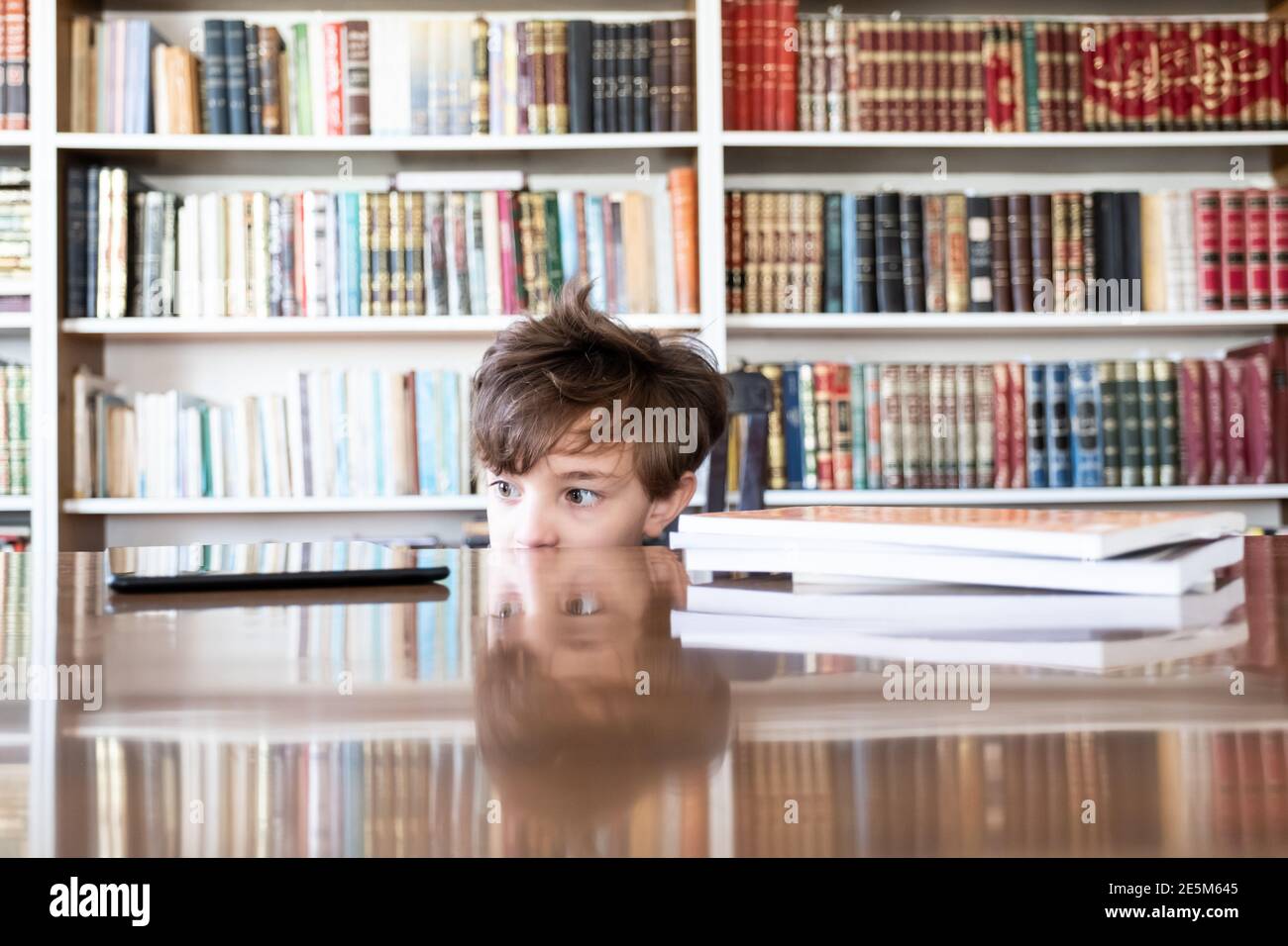 little boy in the library Stock Photo - Alamy