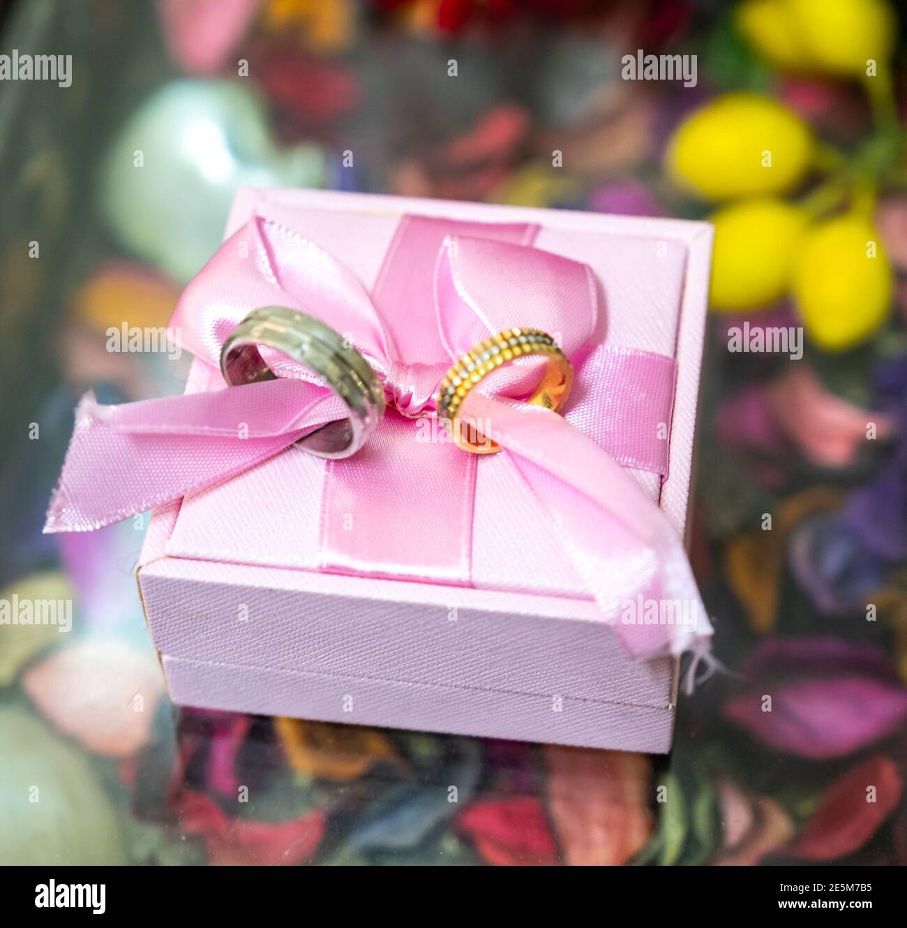 Wedding ring box on table with nice pink color Stock Photo - Alamy