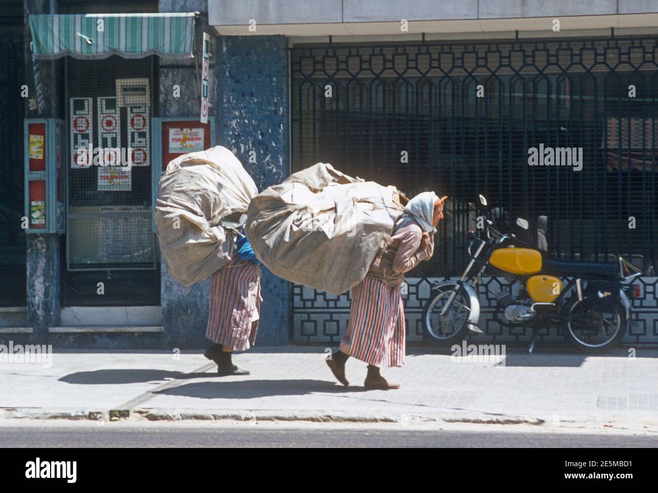 1984 Morocco Tangier - Two Berber women carrying heavy loads on their ...