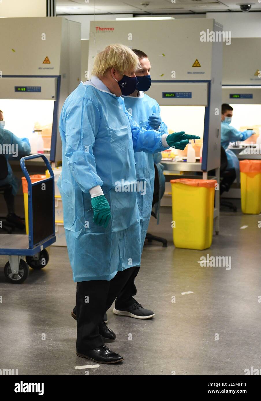 Prime Minister Boris Johnson is shown the Lighthouse Laboratory, used ...