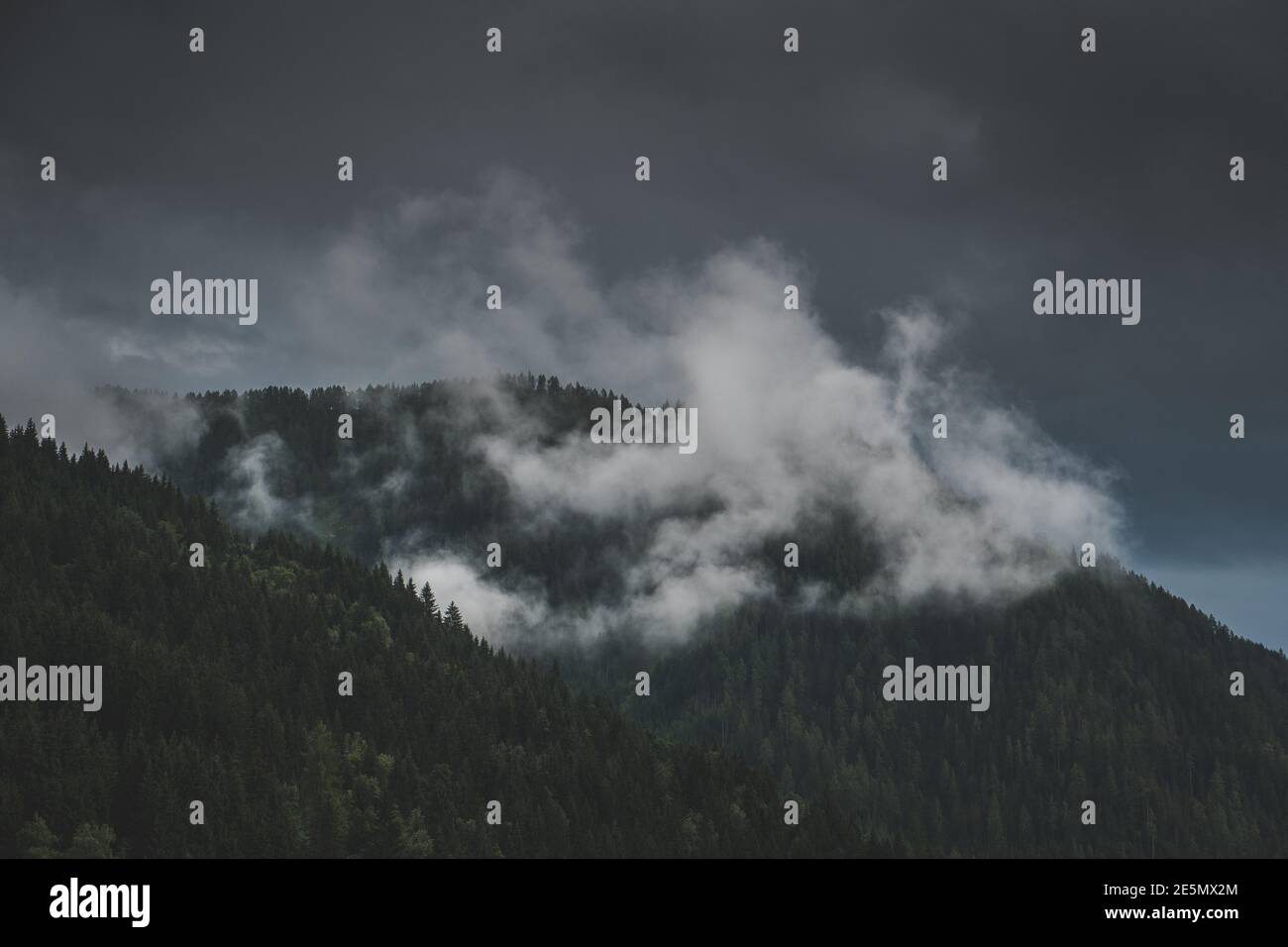 Storm hitting the top of the mountain Stock Photo - Alamy