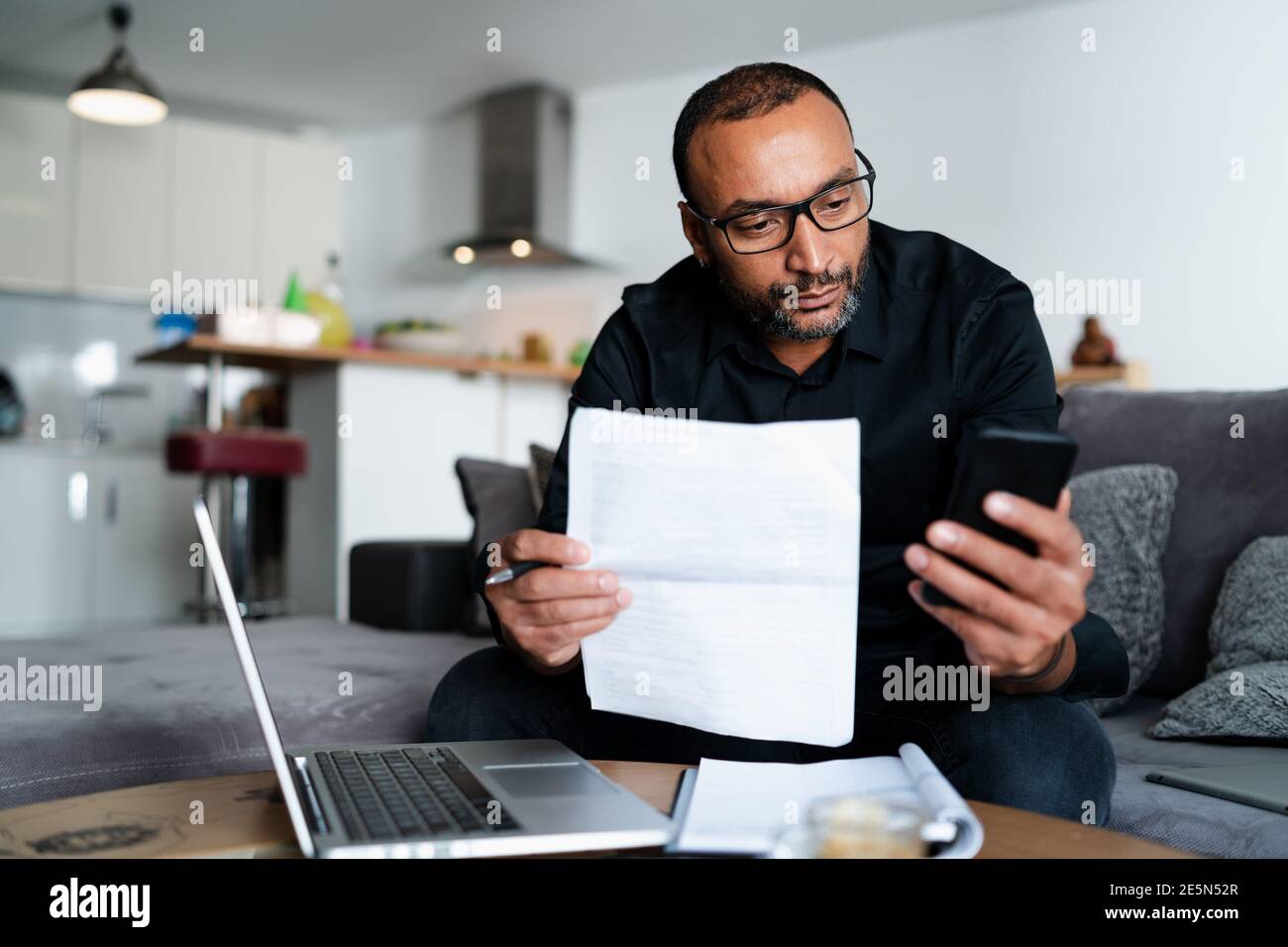 Serious entrepreneur working from home Stock Photo - Alamy