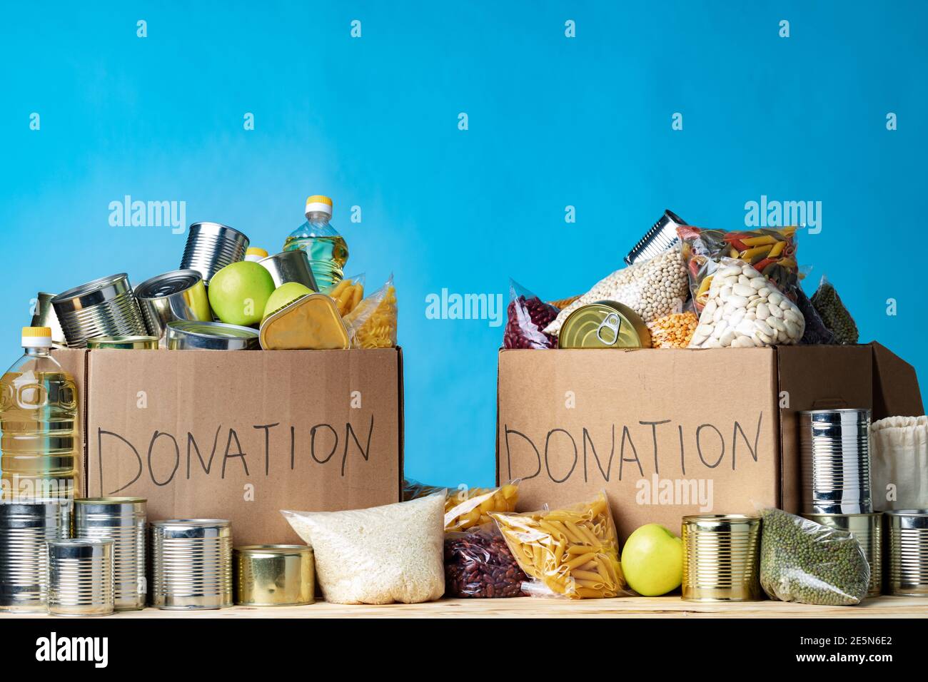 Food donations on the table. Text Donation Stock Photo - Alamy