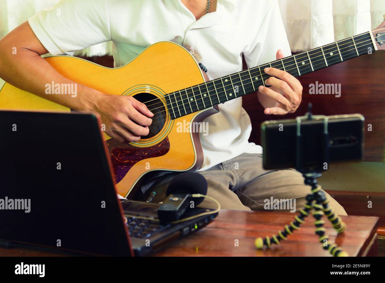 musician live streaming playing guitar show from home Stock Photo - Alamy